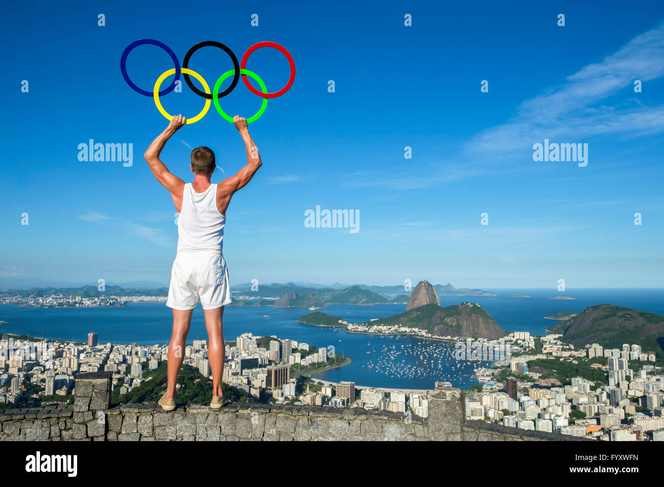 RIO DE JANEIRO - MARCH 21, 2016: An athlete holds Olympic rings under ...
