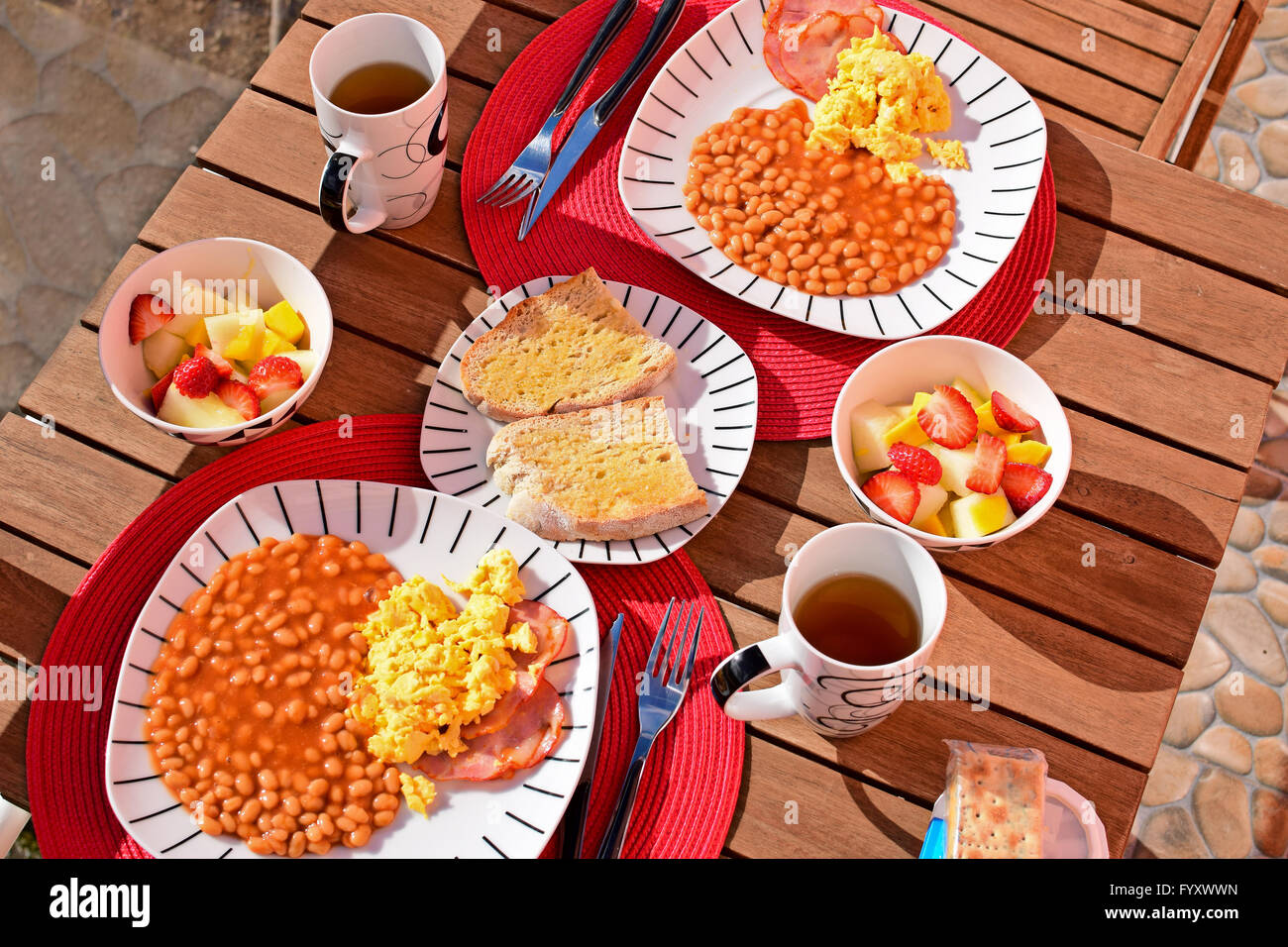 English breakfast for two on a balcony Stock Photo - Alamy