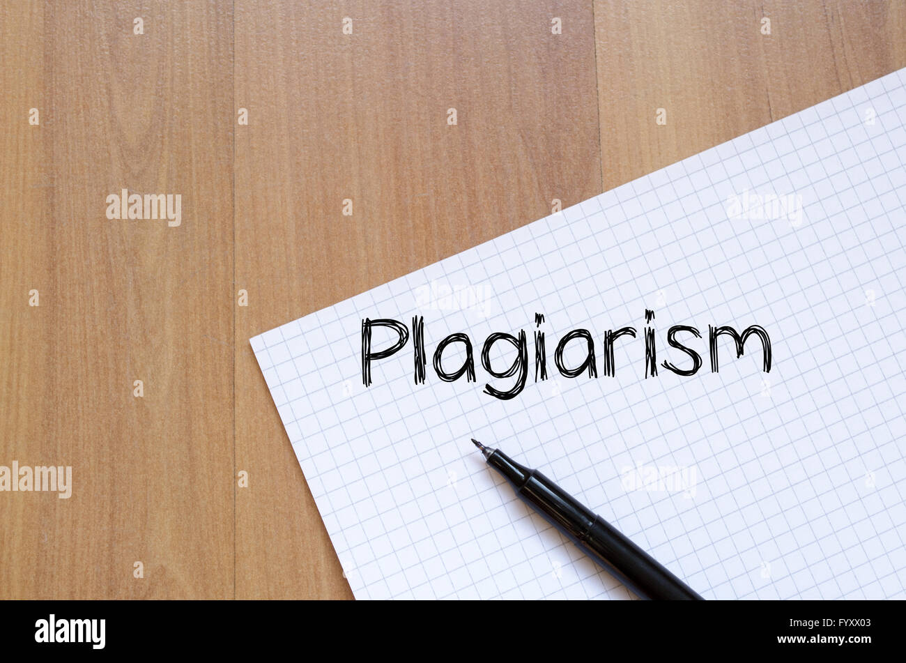 Plagiarism write on notebook Stock Photo - Alamy