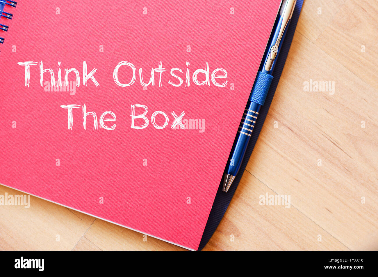 Think outside the box write on notebook Stock Photo - Alamy