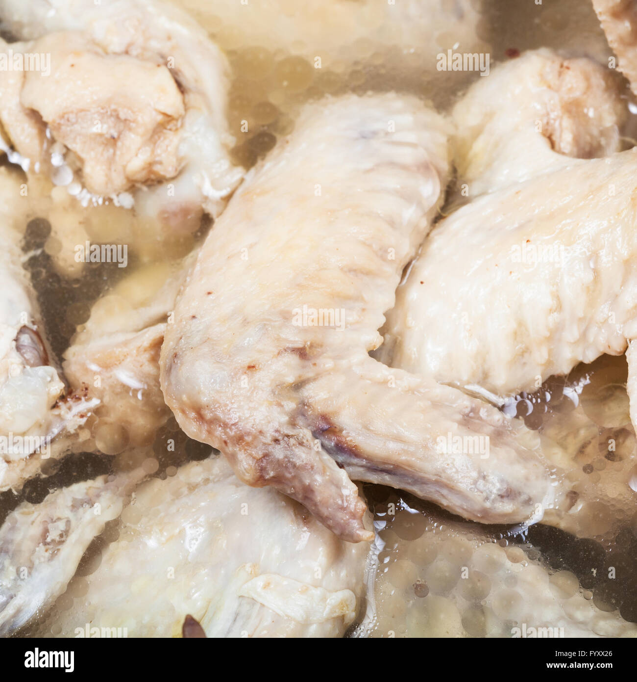 many boiled chicken wings in meat broth close up Stock Photo - Alamy