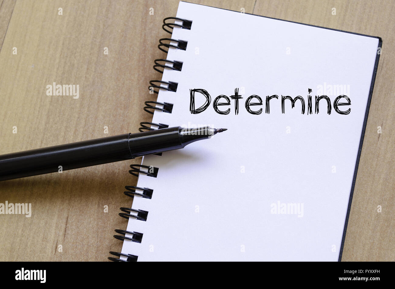 Determine write on notebook Stock Photo - Alamy