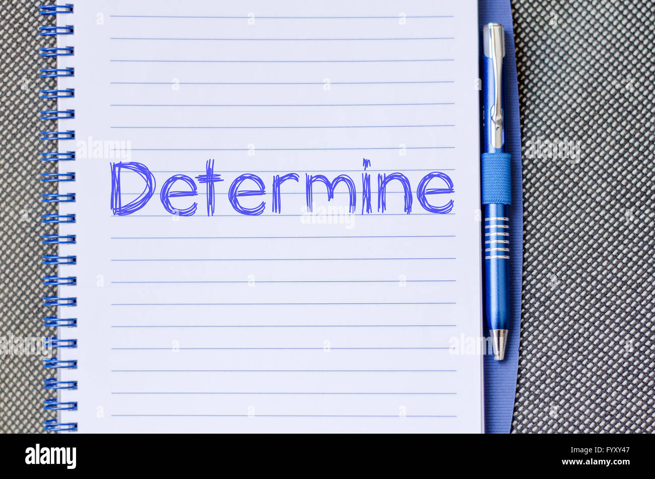 Determine write on notebook Stock Photo - Alamy