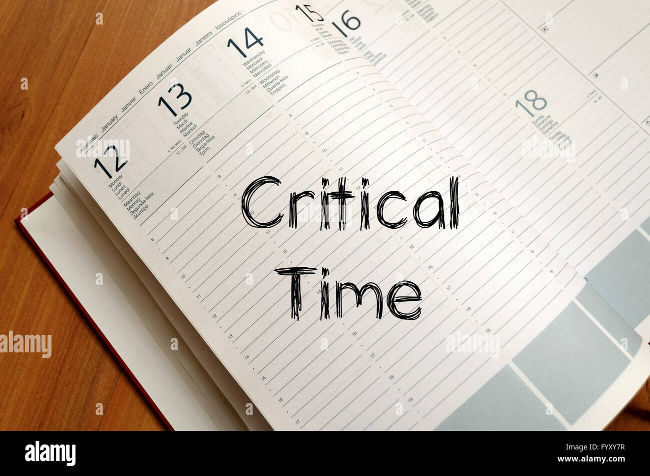 Critical time write on notebook Stock Photo - Alamy