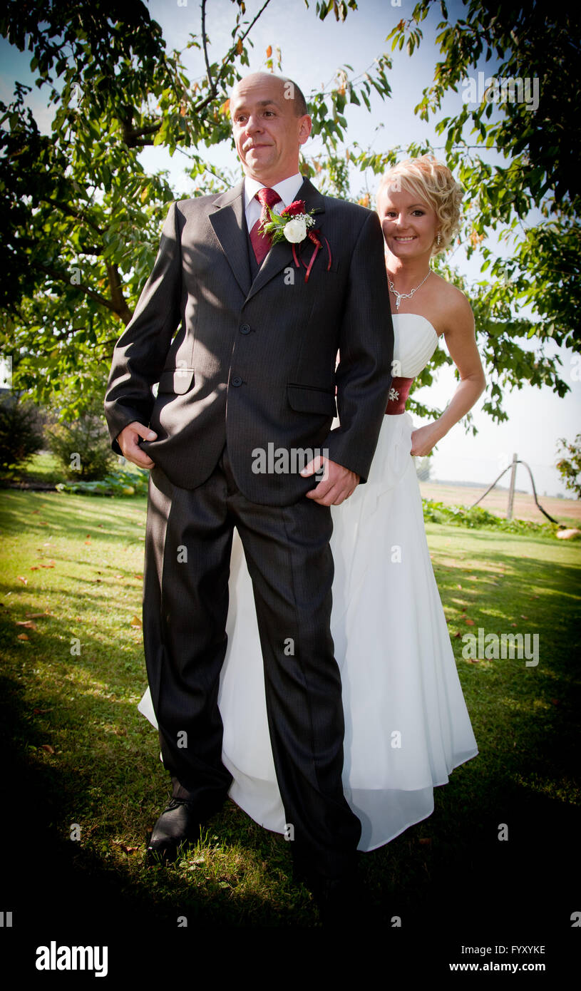 Happy bride and groom after wedding Stock Photo - Alamy