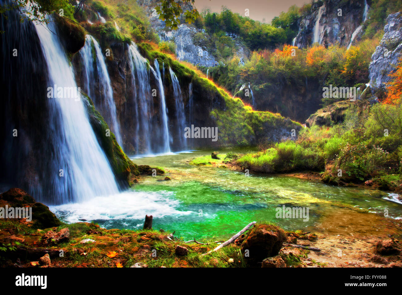 Waterfall in forest. Crystal clear water Stock Photo - Alamy
