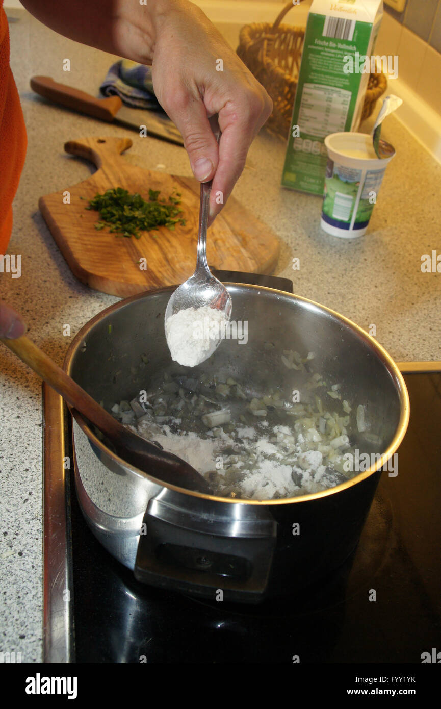 Cooking shaggy ink cap soup Stock Photo - Alamy