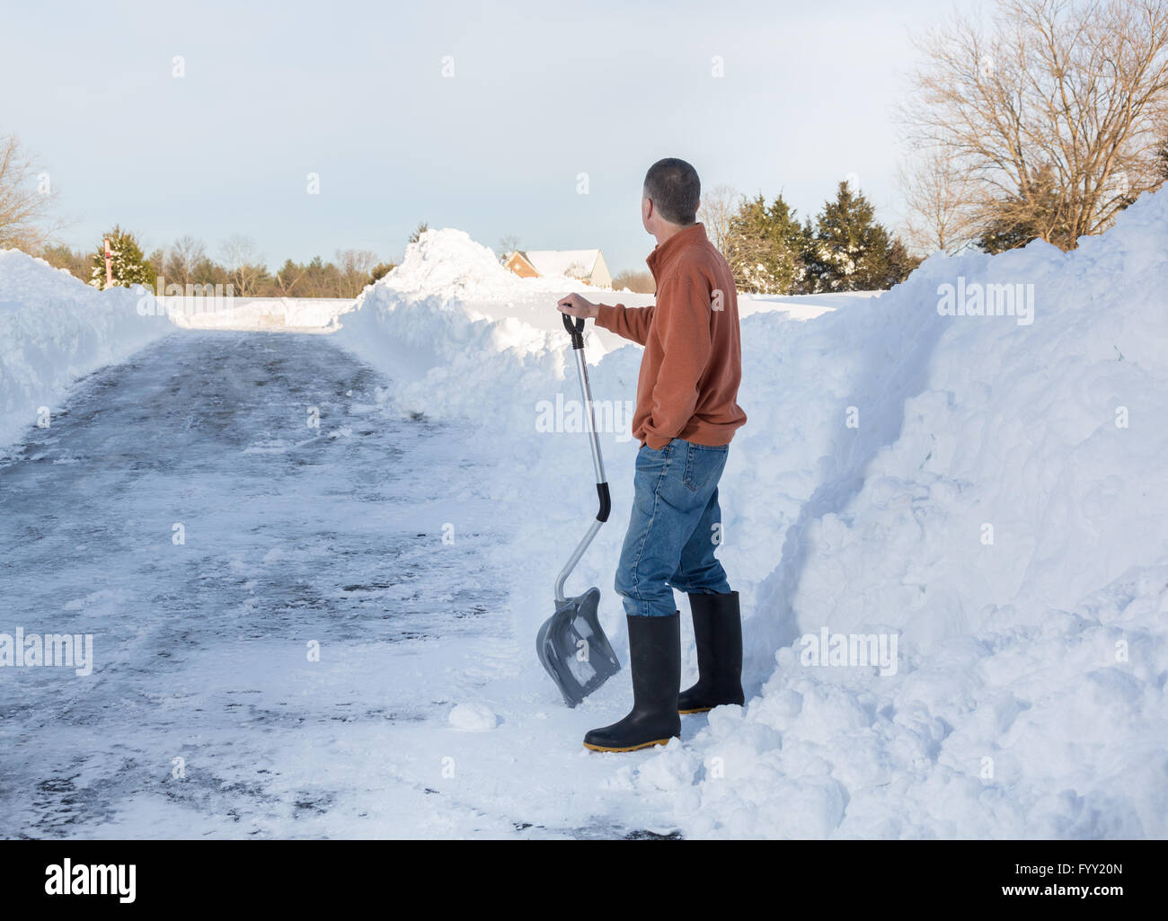 Senior adult man happy after digging out drive in snow Stock Photo - Alamy