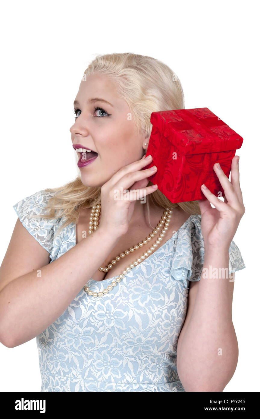Woman shaking gift box hi-res stock photography and images - Alamy