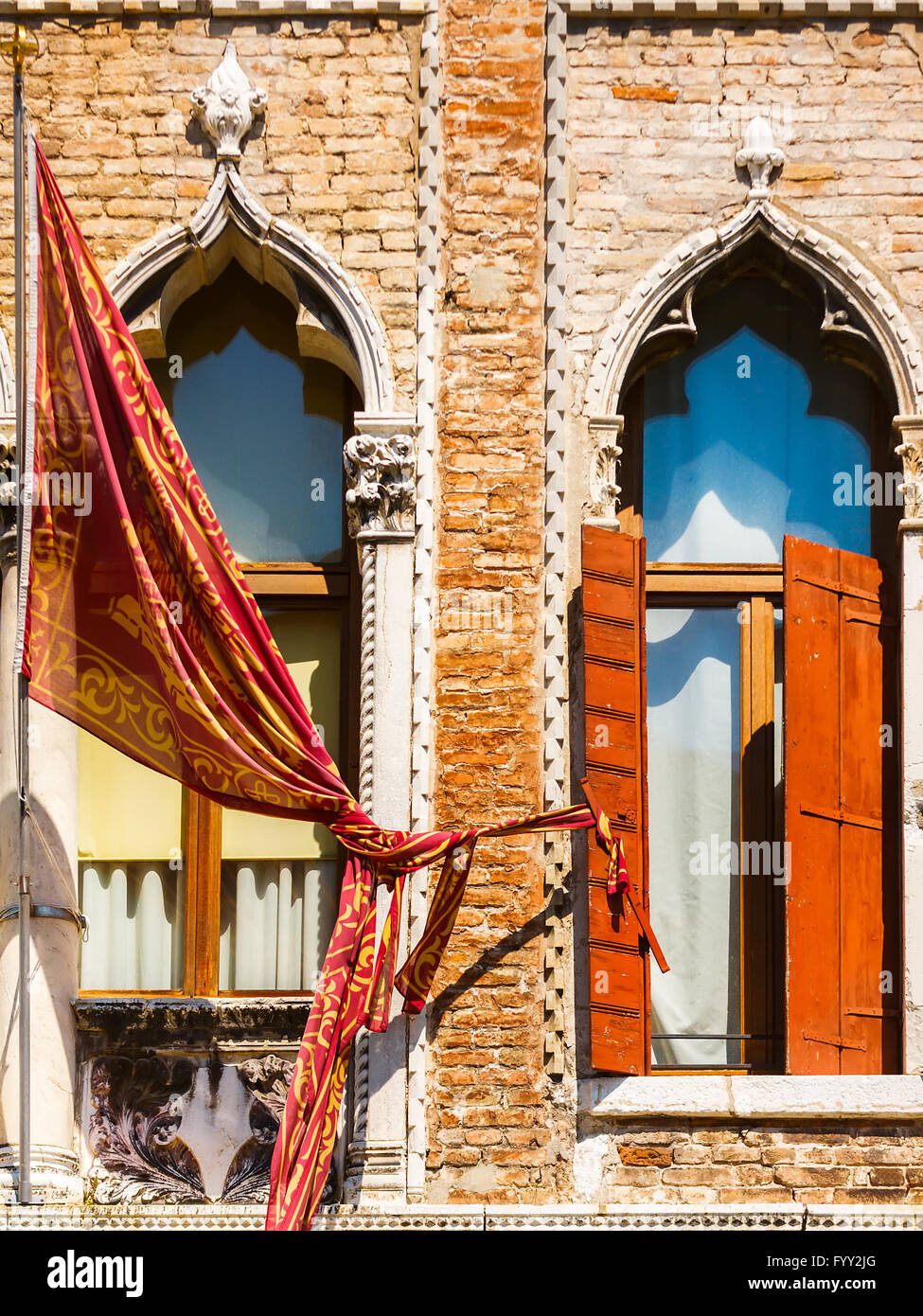 Colored ancient wall with windows and shutters Stock Photo - Alamy