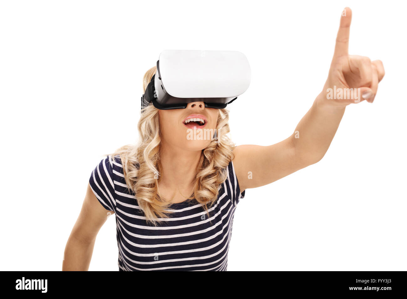 Woman using a VR goggles and reaching to touch something with her ...