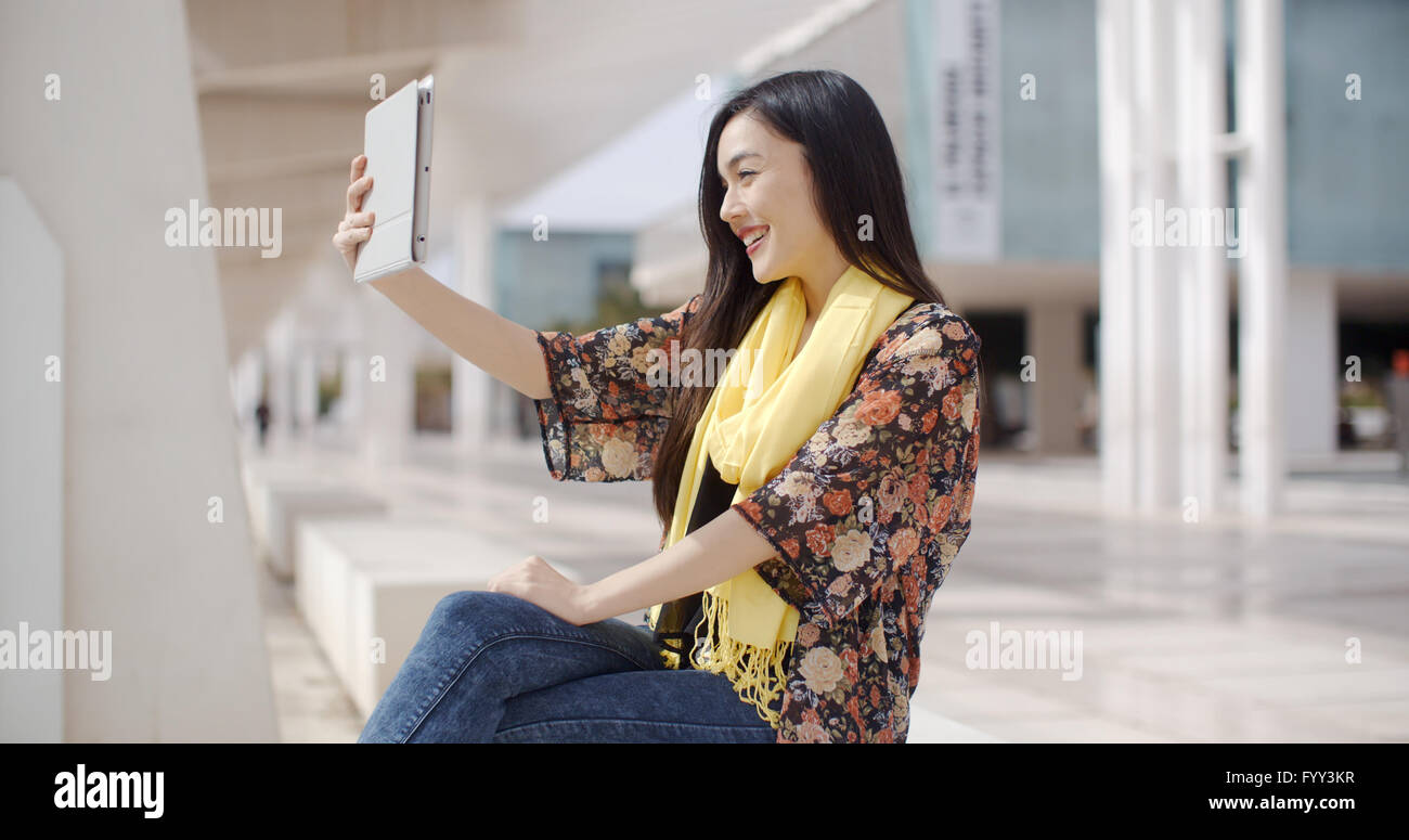 Woman taking a self portrait with tablet Stock Photo - Alamy
