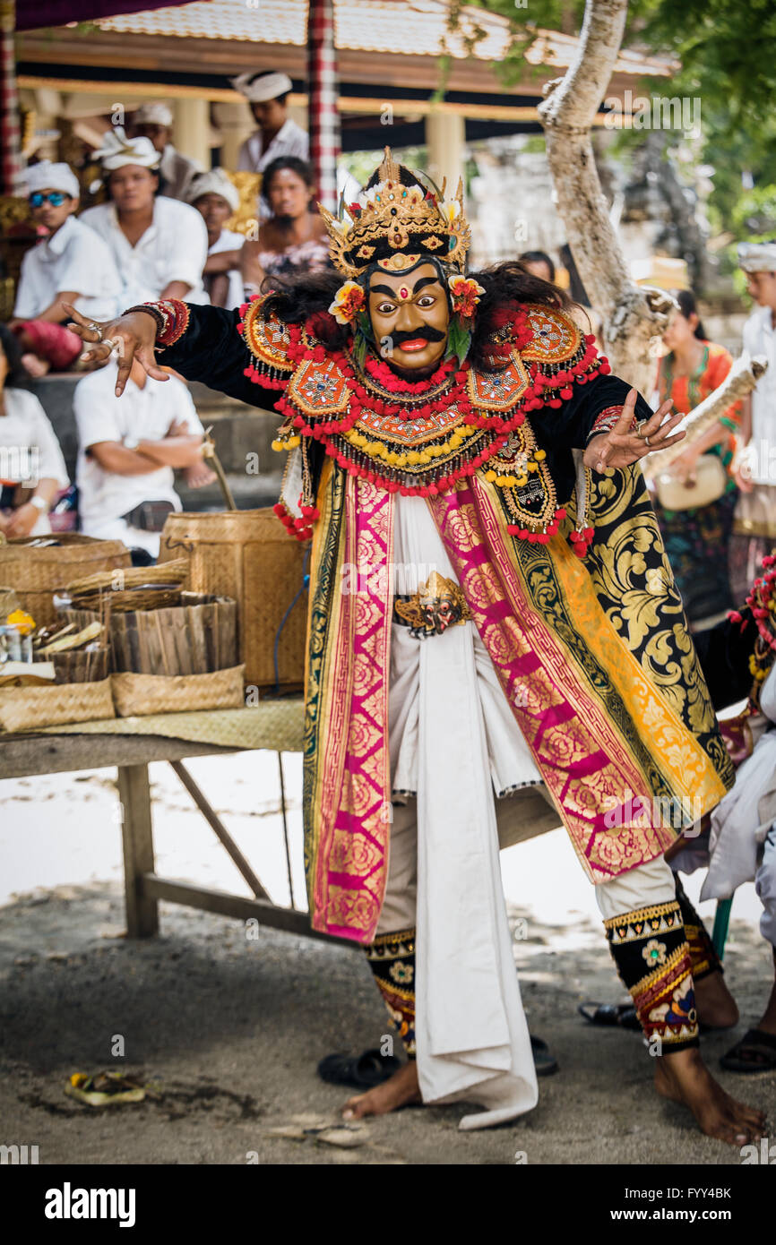 Balinese man in mask performing at Kuningan Ceremony during the ...