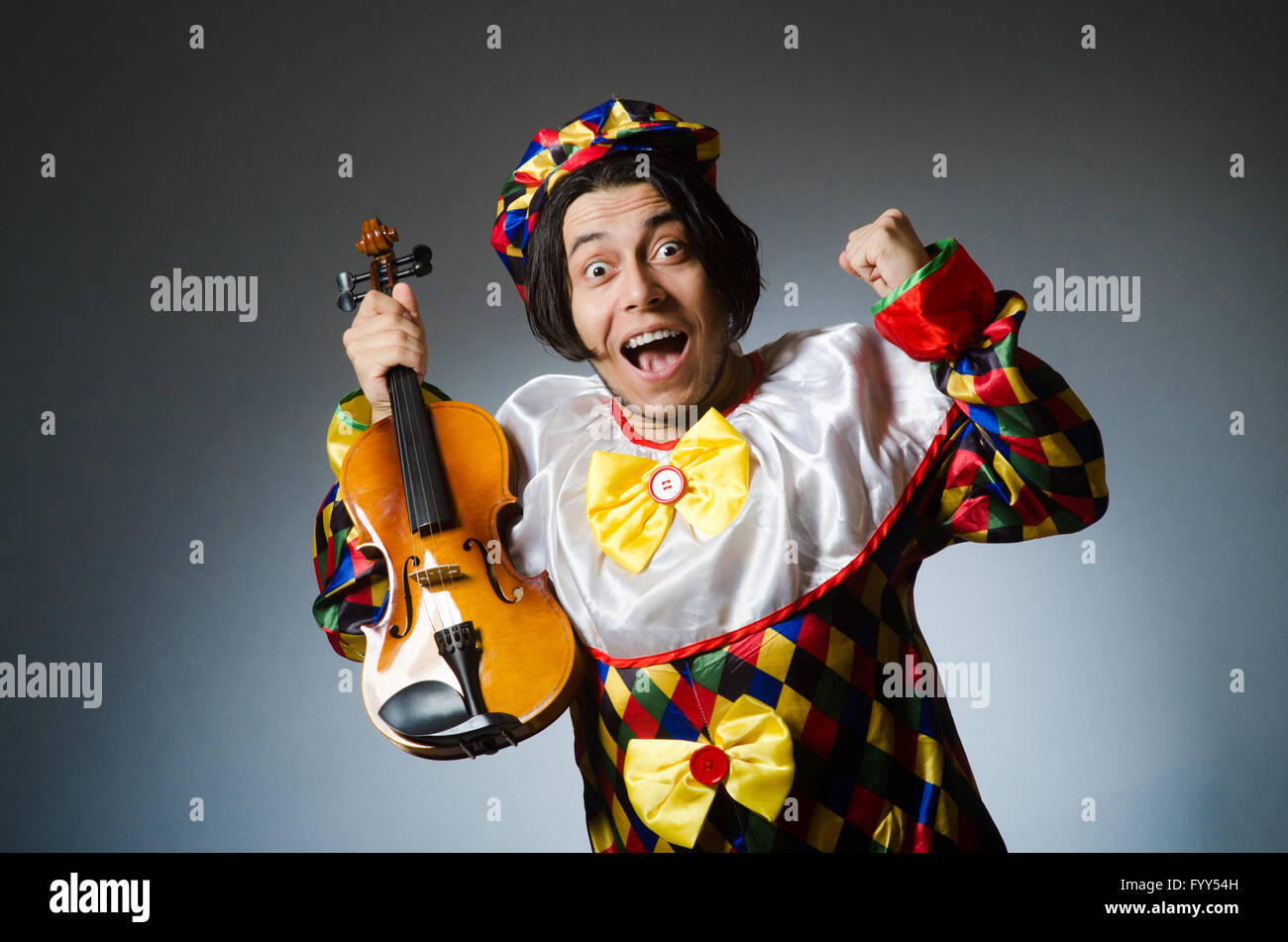 Funny violin clown player in musical concept Stock Photo - Alamy