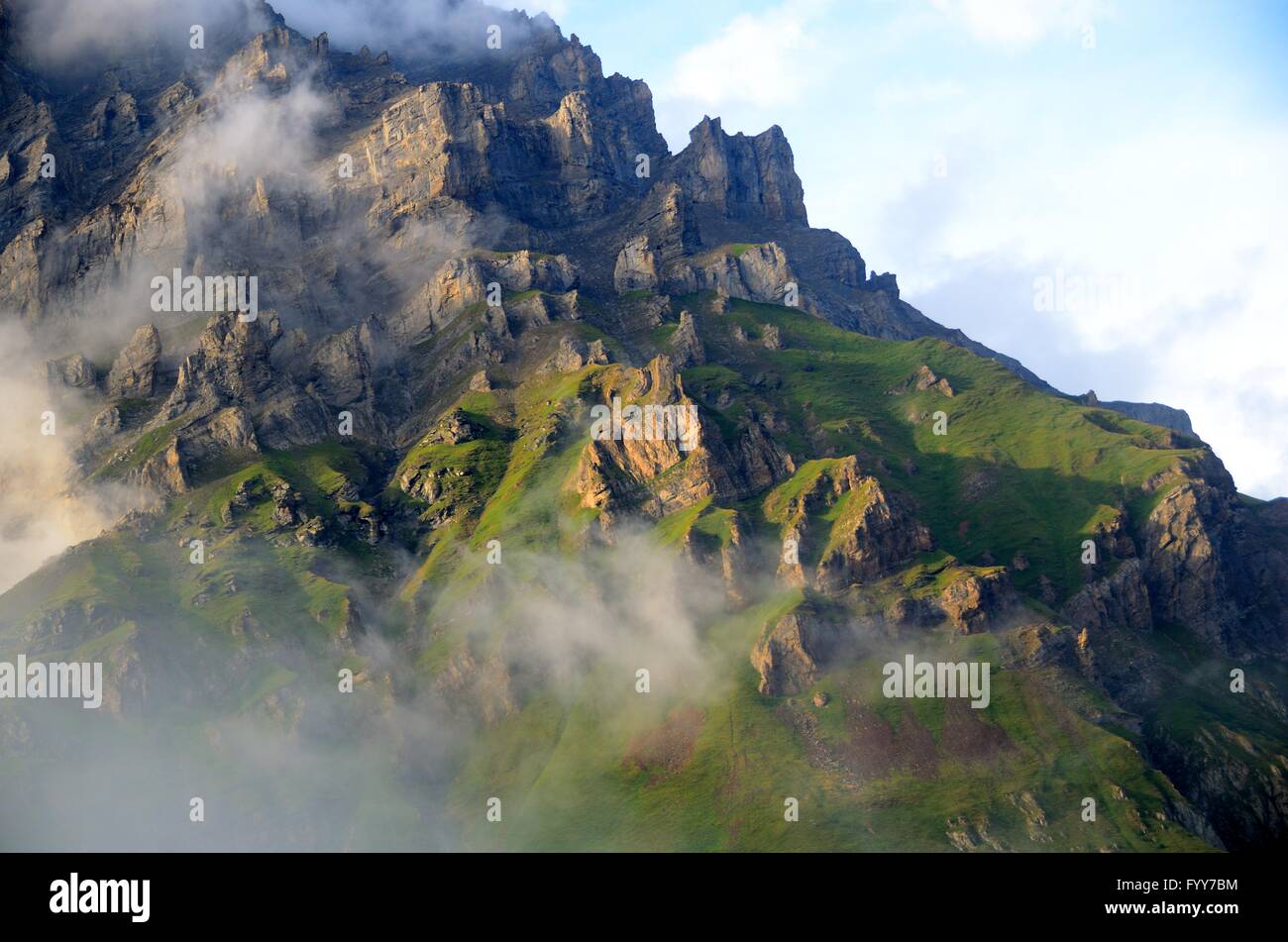 Rugged mountain in clouds Stock Photo - Alamy