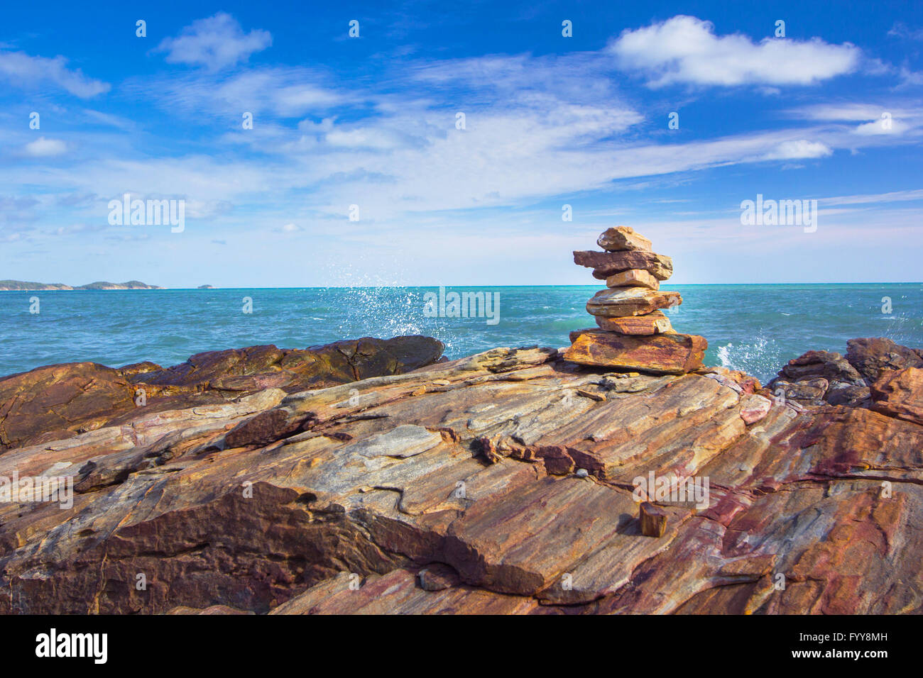 sea beach stone stack stable and wave splash abstract and blue sky ...