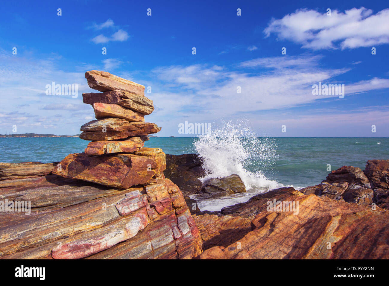 sea beach stone stack stable and wave splash abstract and blue sky ...