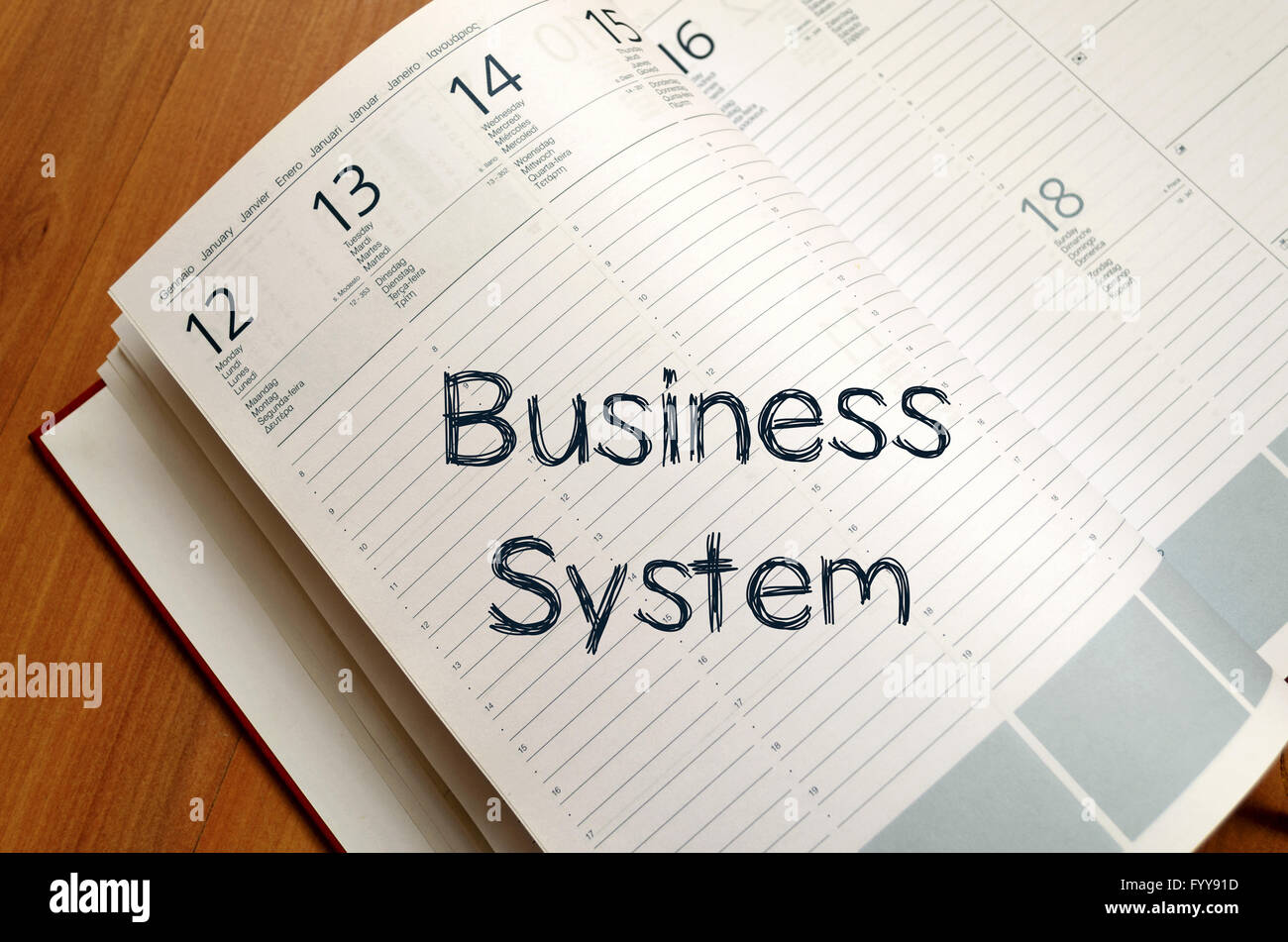 Business system write on notebook Stock Photo - Alamy