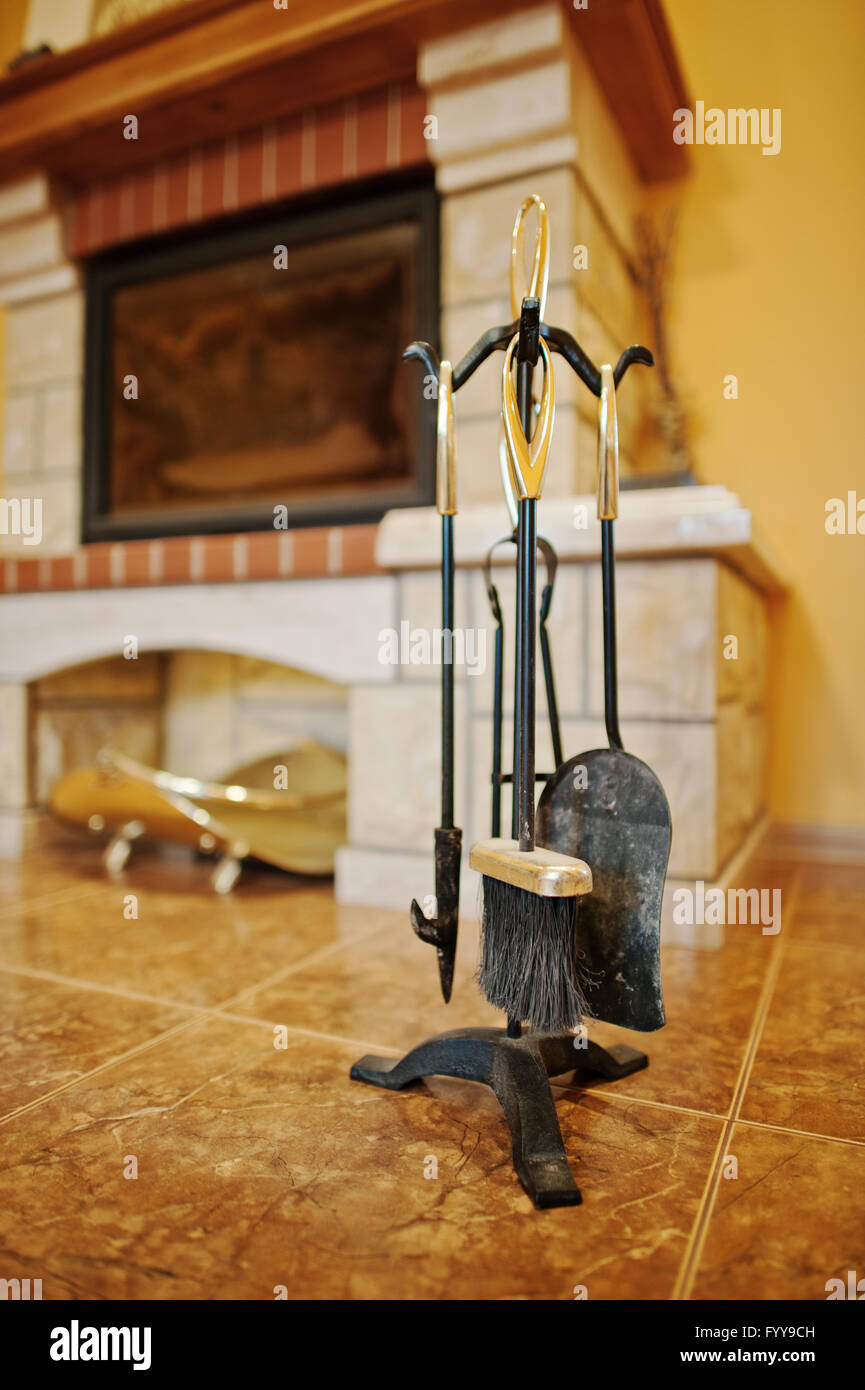 Fireplace accessories tools background fireplace Stock Photo - Alamy
