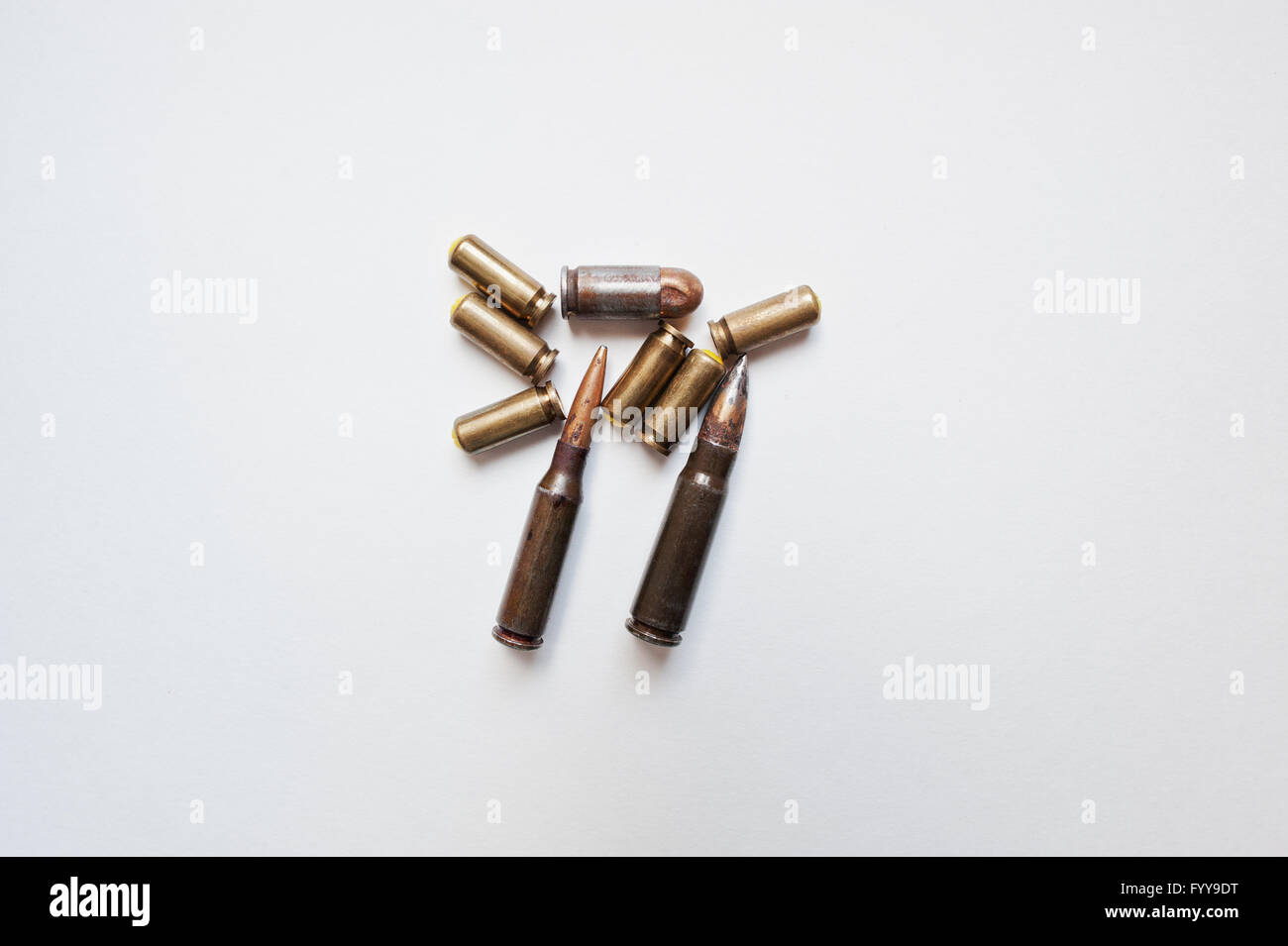 Rifle and pistol bullets on white background Stock Photo - Alamy