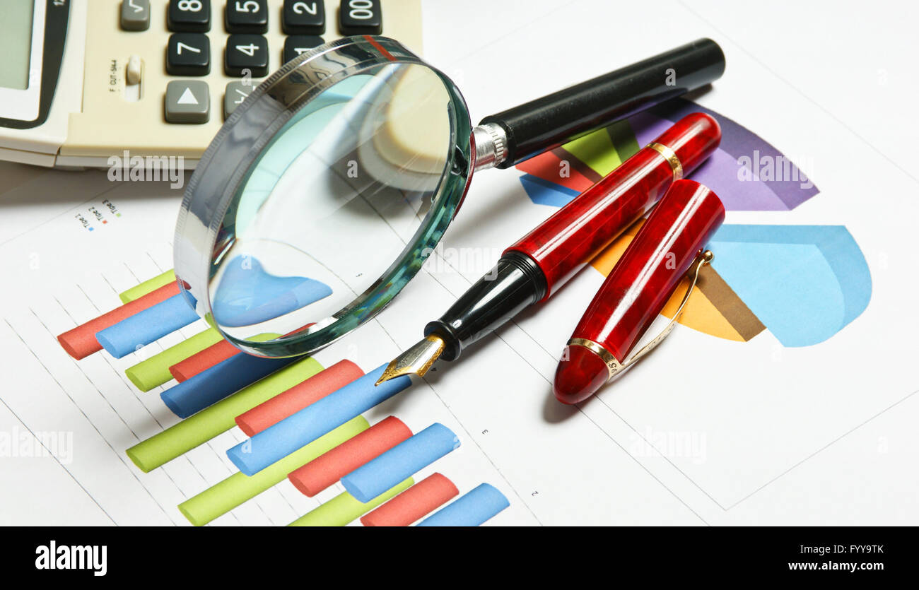 magnifying glass and the working paper Stock Photo - Alamy