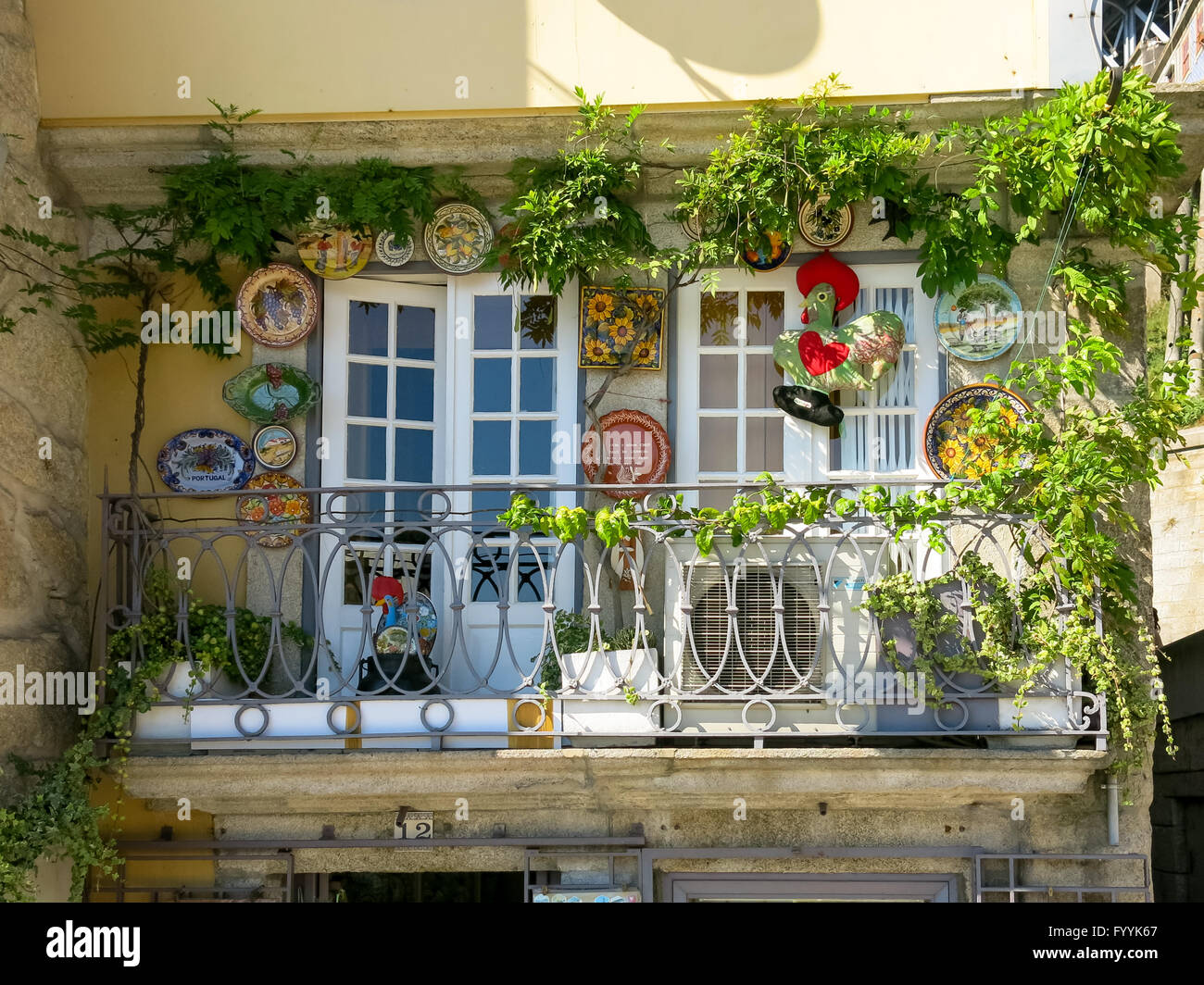 Balcony of house in old historical district of Ribeira in Porto ...