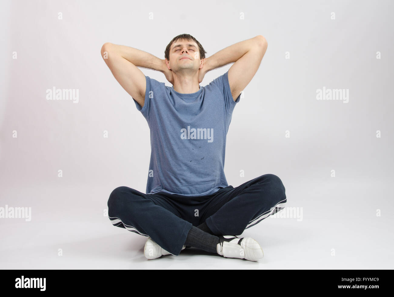 Athlete stretches the muscles of back Stock Photo - Alamy