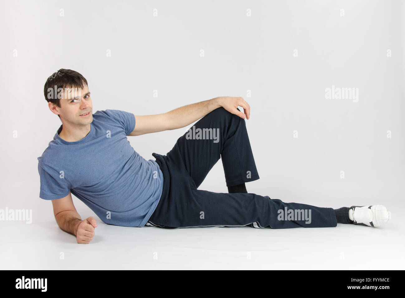 Athlete resting reclining after complex of exercises Stock Photo - Alamy