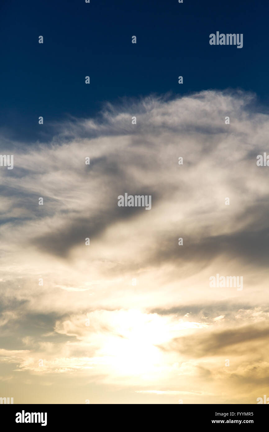 sunset sun in the sky fluffy cloudscape Stock Photo - Alamy