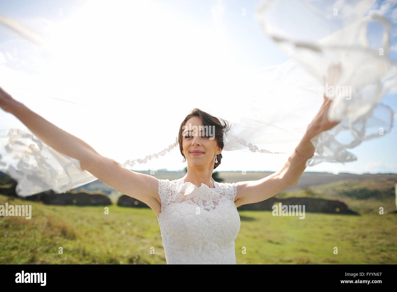 Bride play on wind with veil Stock Photo - Alamy