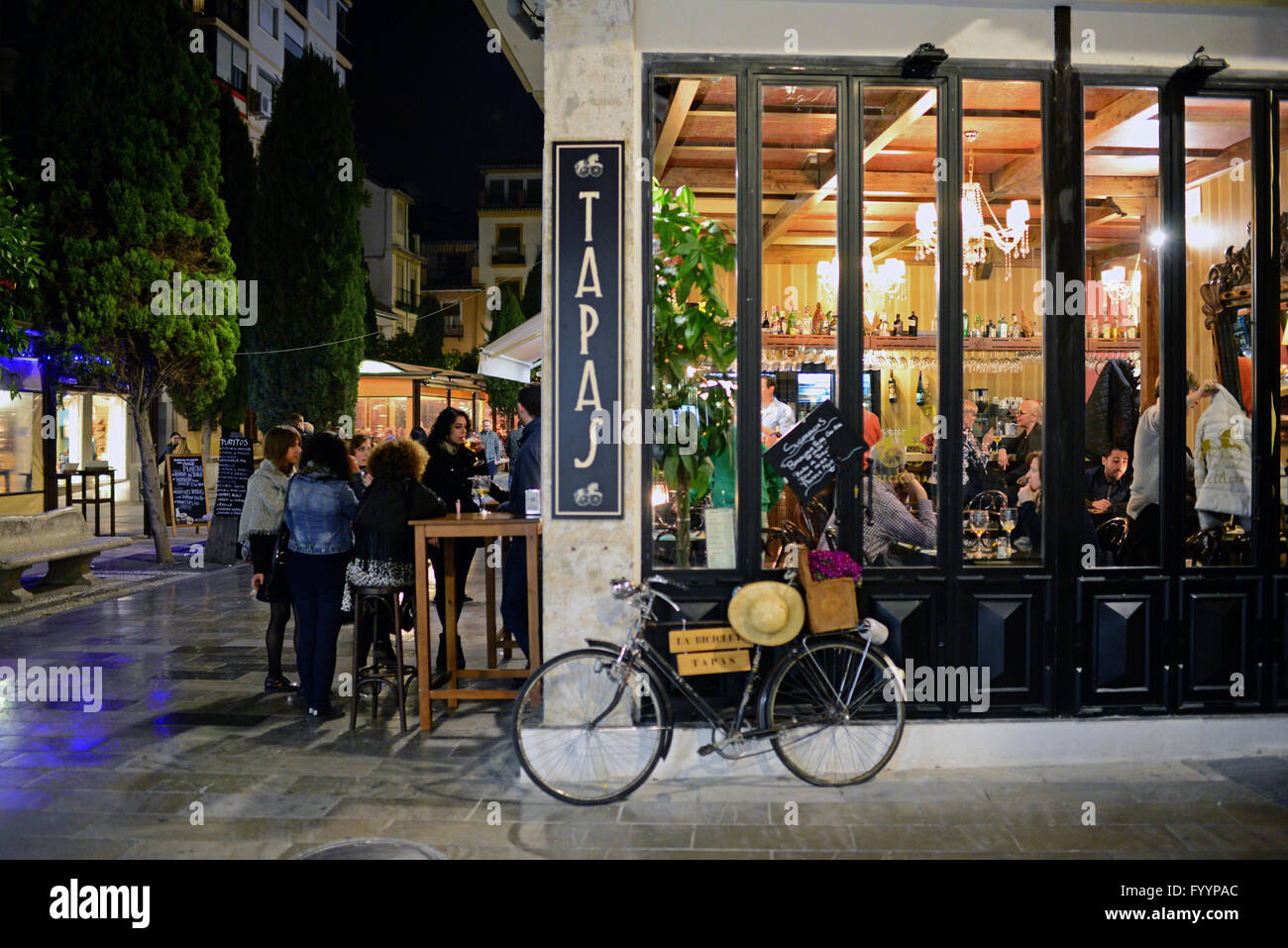 Tapas bars at night in Granada, Spain Stock Photo - Alamy