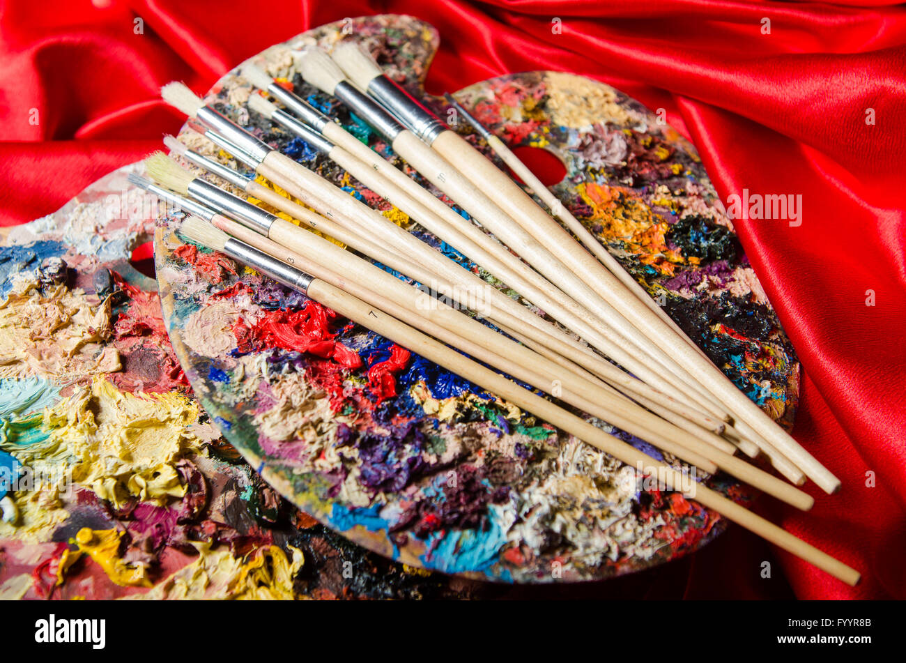 Art concept with palette and brushes Stock Photo - Alamy