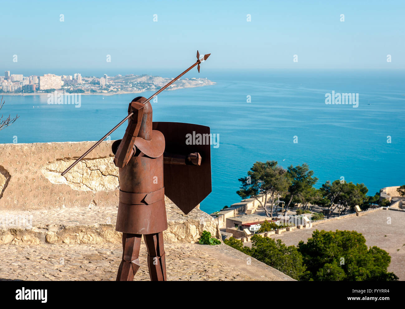 The rusty knight in the Santa Barbara castle and view of Alicante coast ...