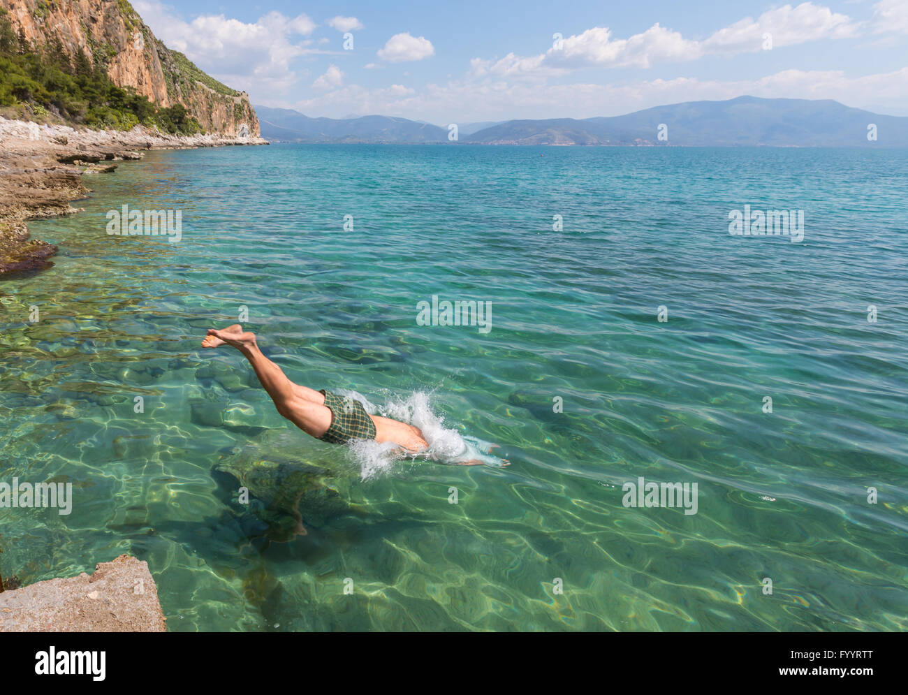 Jumping into sea Stock Photo - Alamy