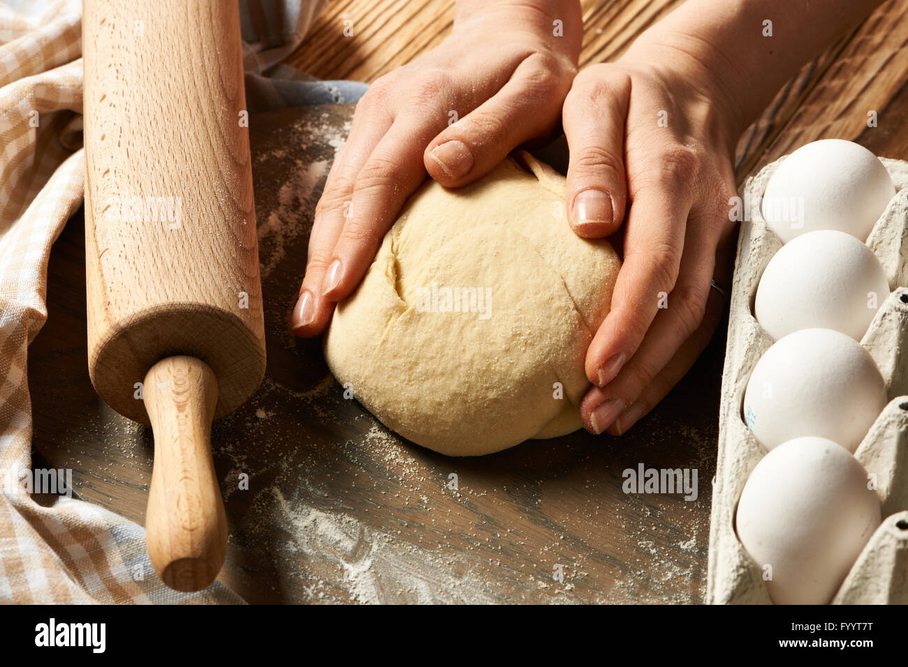 Female hands kneading dough Stock Photo - Alamy