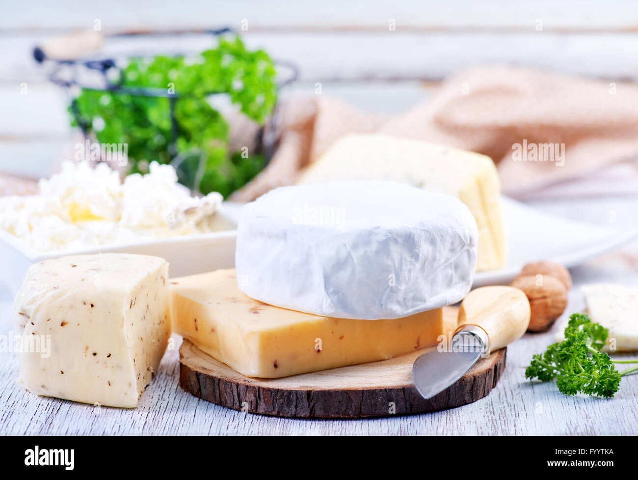 cheese on board and on a table Stock Photo - Alamy