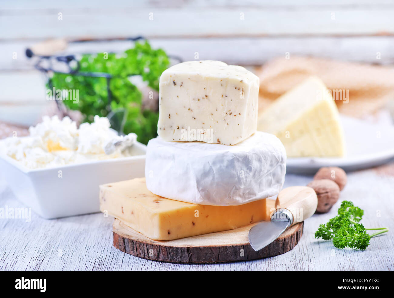 cheese on board and on a table Stock Photo - Alamy