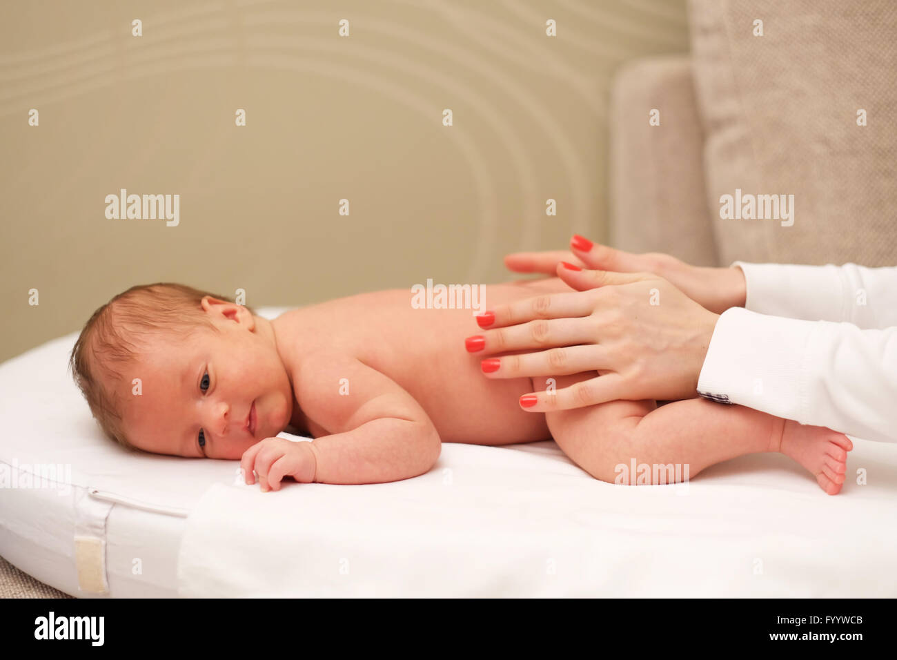 Newborn baby massage Stock Photo - Alamy