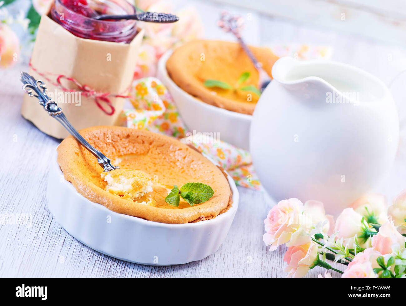 cheese cake with jam on a table Stock Photo - Alamy