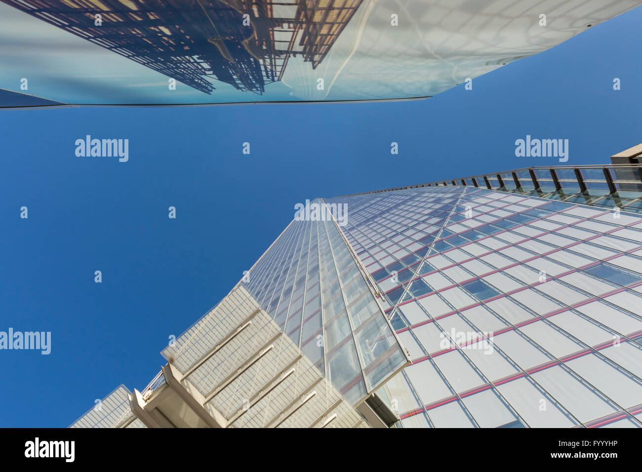 View up the Shard of London skyscraper and adjoining building in London ...