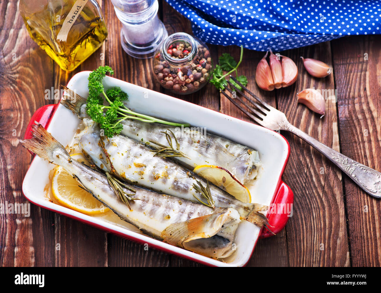 fried fish in bowl and on a table Stock Photo - Alamy