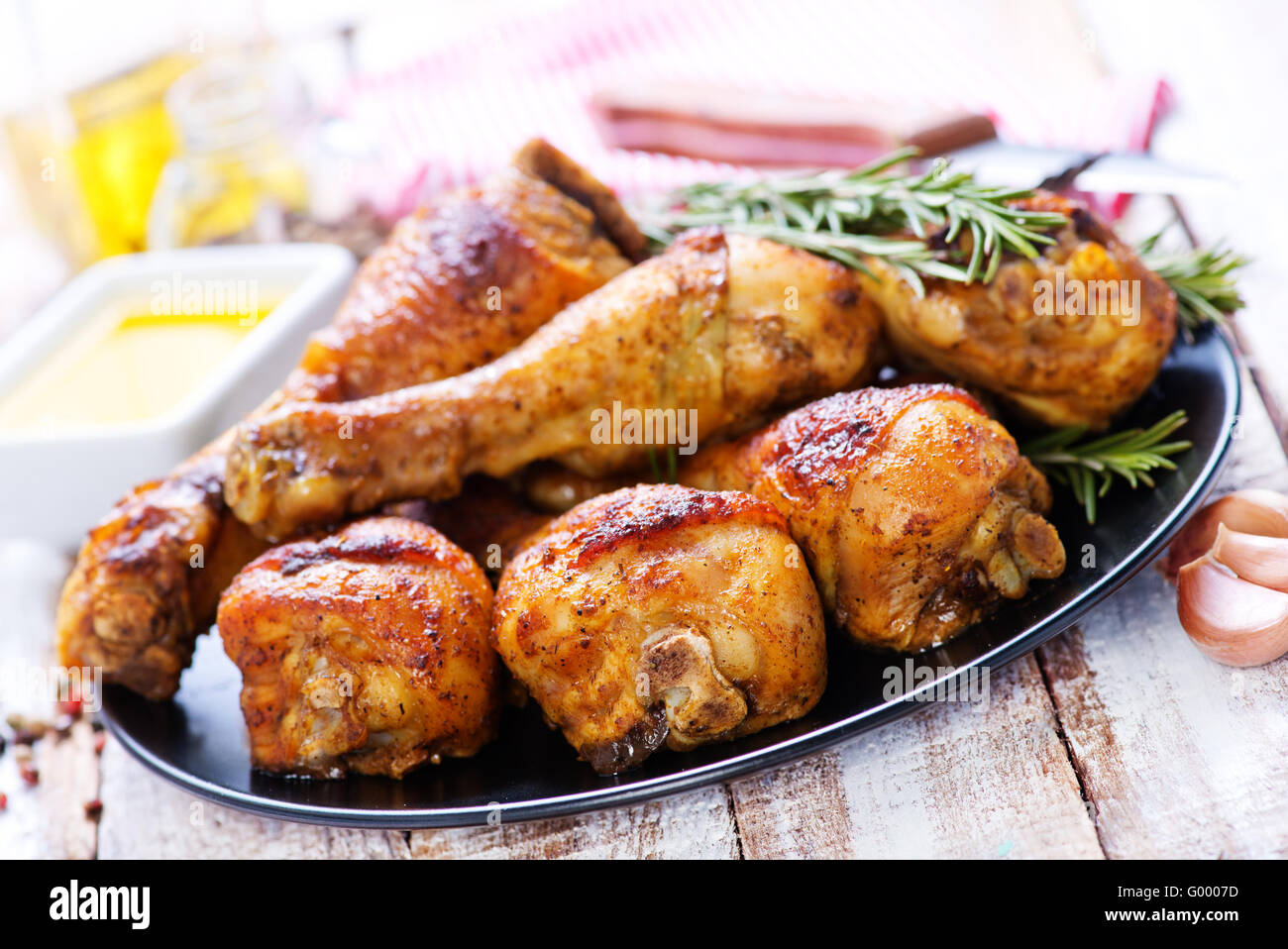 baked legs in bowl and on a table Stock Photo - Alamy