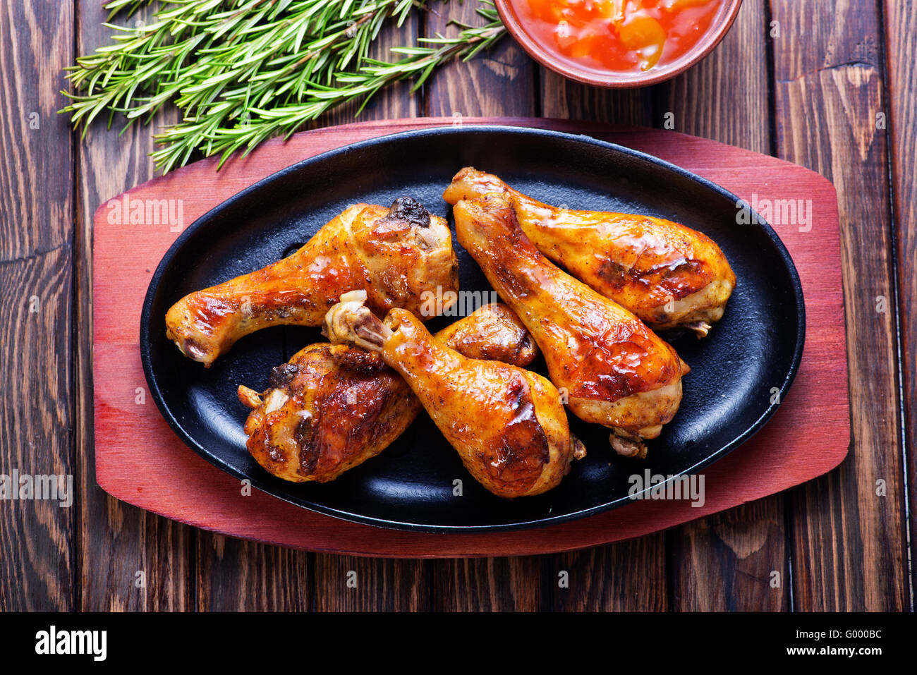 baked legs in bowl and on a table Stock Photo - Alamy