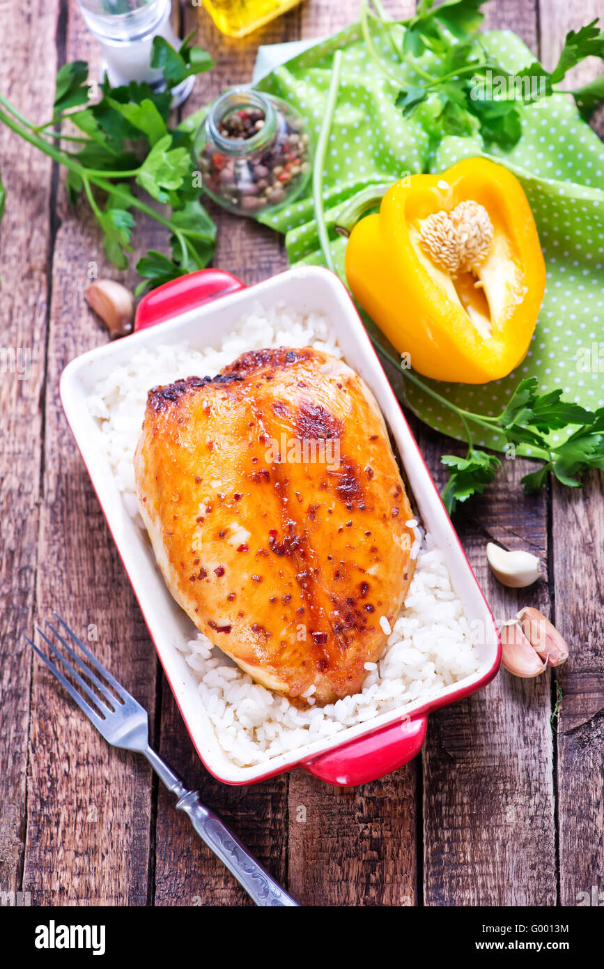 chicken fillet on plate and on a table Stock Photo - Alamy