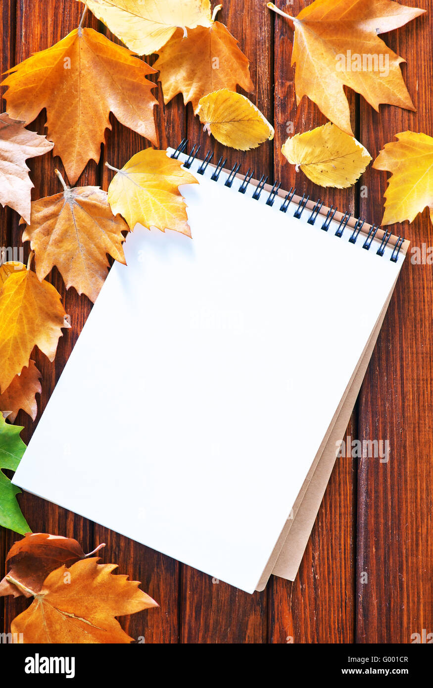 autumn background, yellow leaves on a table Stock Photo - Alamy