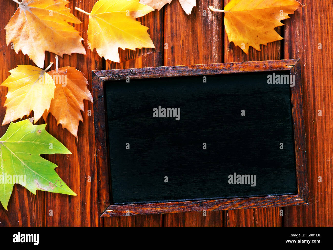 autumn background, yellow leaves on a table Stock Photo - Alamy