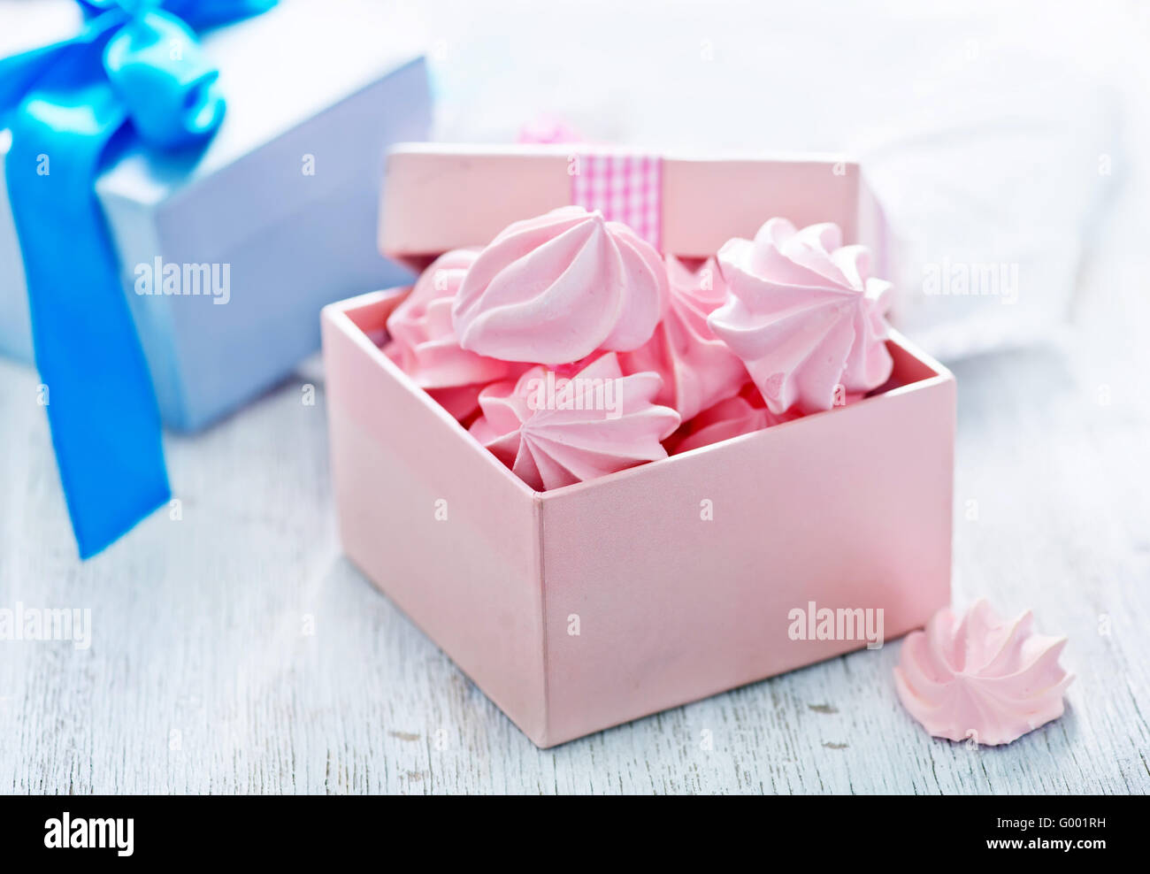 color mini meringues on the wooden table Stock Photo - Alamy