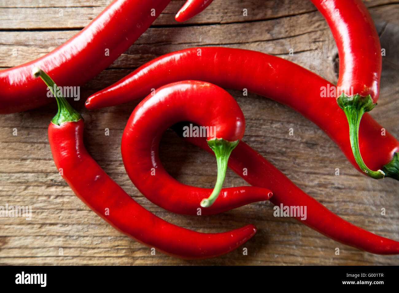 Fresh bright Red Chili Pepper on wooden board Stock Photo - Alamy