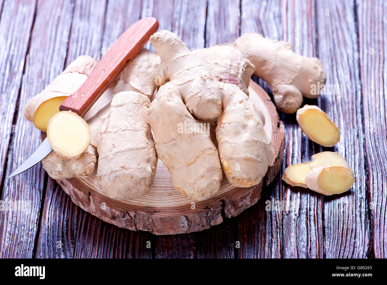 fresh ginger on board and on a table Stock Photo - Alamy