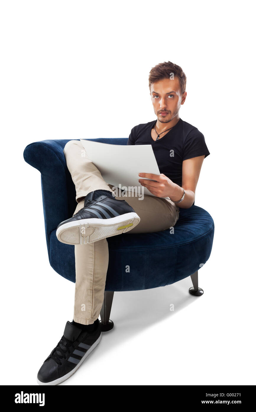 Portrait of a male sitting on chair Stock Photo - Alamy